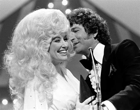 See Dolly Partons Iconic Hairstyles Through The Years