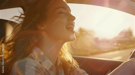 Shot Of Pretty Young Women Singing While Driving A Car On Road Trip On Beautiful Summer Day