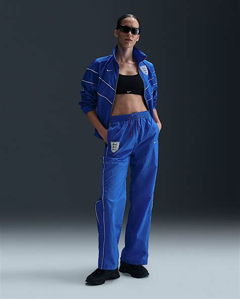 Windrunner Inglaterra Pantalón de fútbol de tejido Woven y talle alto Nike Mujer Nike ES