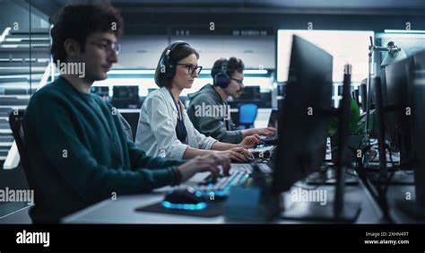 Team Of Diverse Multiethnic Software Developers Working On Computers