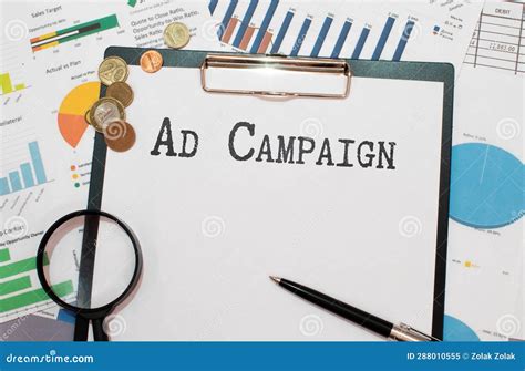 Page With Text Ad Campaign And Paper Signs Of Dollar On Wooden Table