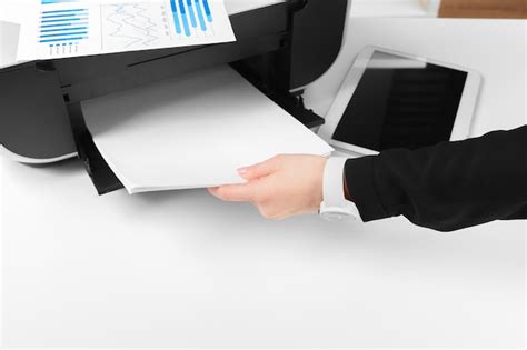 Premium Photo Person Using The Printer To Scanning And Printing Document