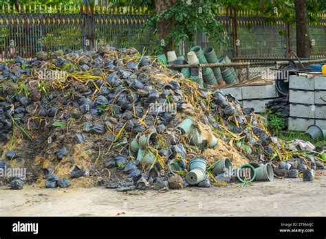 Heap Of Waste Garbage Dump With Pots And Leaves Of Dried Plants In Rural Areas Of Agro