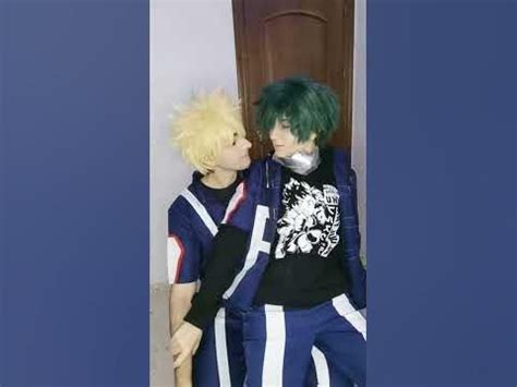 Two People Are Dressed In Costumes And One Is Kissing The Other S Face With Green Hair