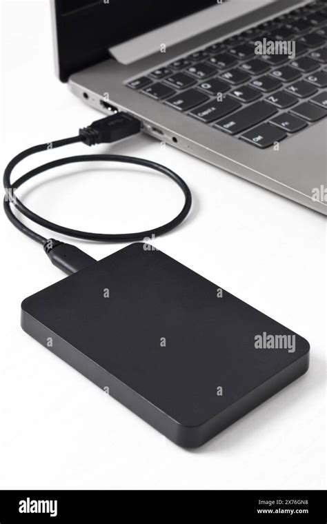 External Backup Hard Disk Drive Connected To Laptop On White Background External Hard Disk