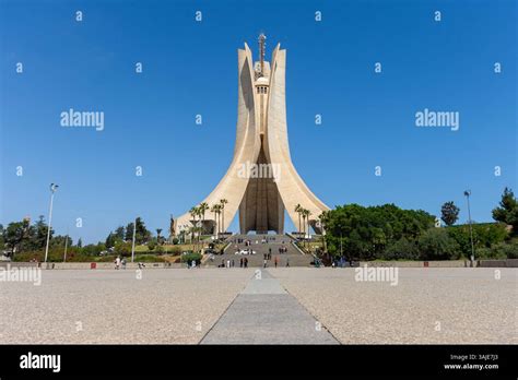 A Group Of People In Maqam Echahid Monument Square In Algiers City