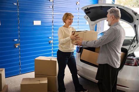 Premium Photo Female With Cardboard Boxes In Self Storage Unit