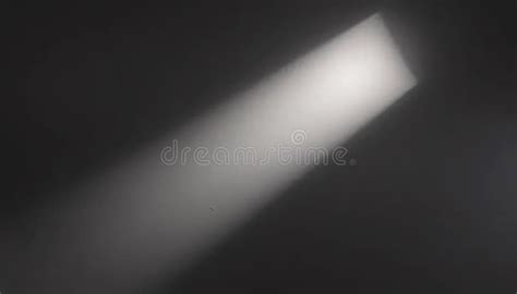 The Image Shows A White Rectangular Shaped Light Shining Down On A Gray Wall Creating A