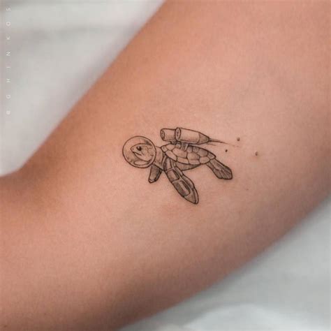 Astro Turtle Tattoo Located On The Inner Forearm