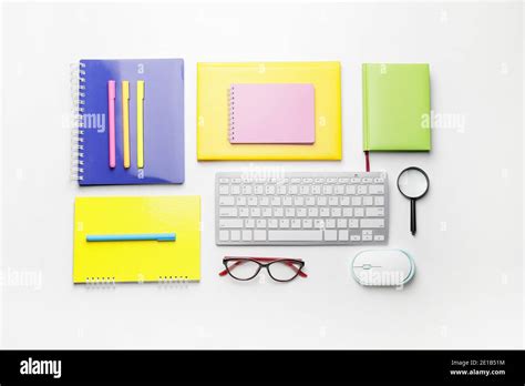 Composition With Computer Keyboard Mouse Magnifying Glass And Stationery On White Background