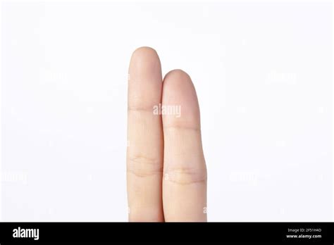 Closeup Of The Middle And Index Finger Of A Person Isolated On A White