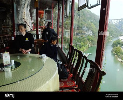 A View Of The Fangweng Restaurant Hanging On The Cliff Of The Happy