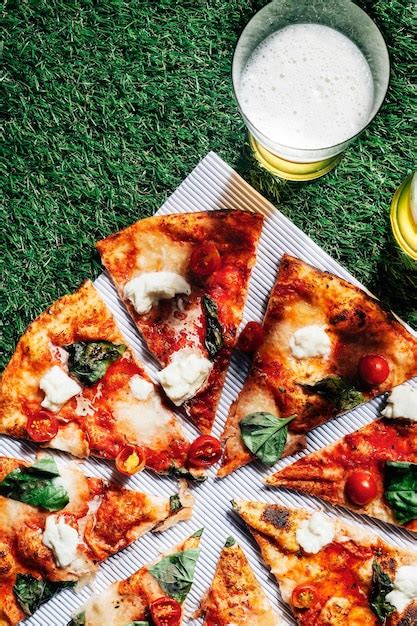 Premium Photo High Angle View Of Pizza And Drink On Grass
