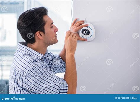 The Man Installing Surveillance Cctv Cameras At Home Stock Photo Image Of Electrician