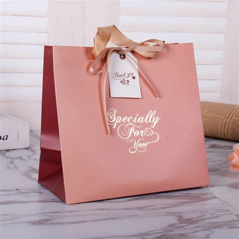 커스텀 골드 핫 포일 로고 종이 선물 가방 의 고품질 커스텀 골드 핫 포일 로고 종이 선물 가방