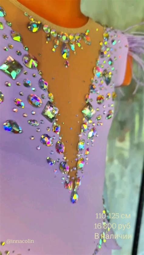 купальник для художественной гимнастики сиреневый с перьями со стразами 110 125 см 16 800 руб ใน