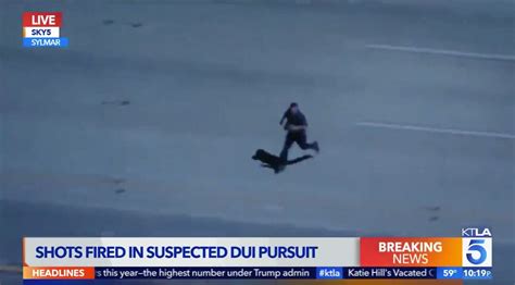 Suspect Sprints Across Los Angeles Freeway Tries To Avoid Being Hit By