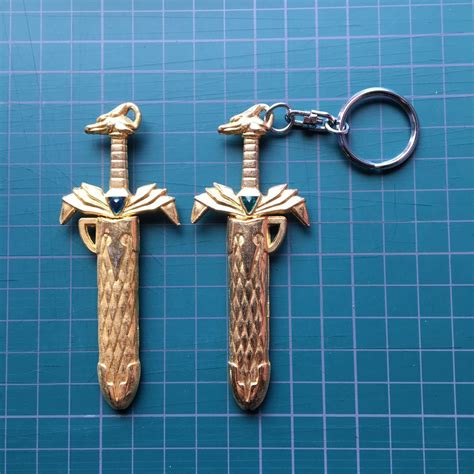 Yahooオークション 金色 ドラゴン 剣 キーホルダー 2個