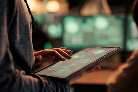 Premium Photo Hacker Using Spyware On Digital Tablet For Illegal