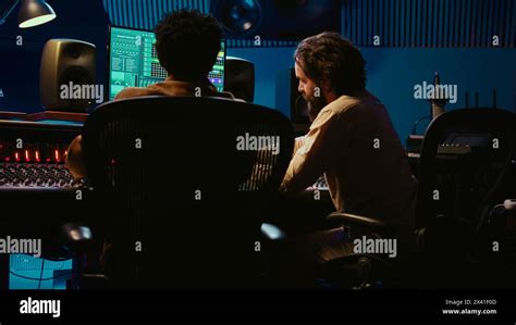 Audio Expert And Musician Mixing And Mastering Tracks On Control Room