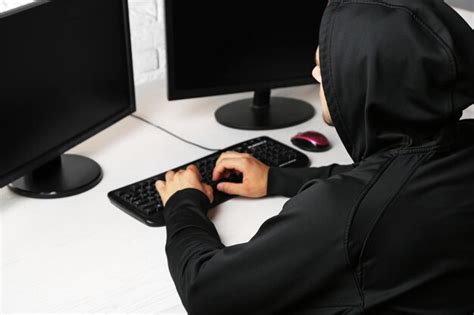 Premium Photo Hacker With Computers In Room