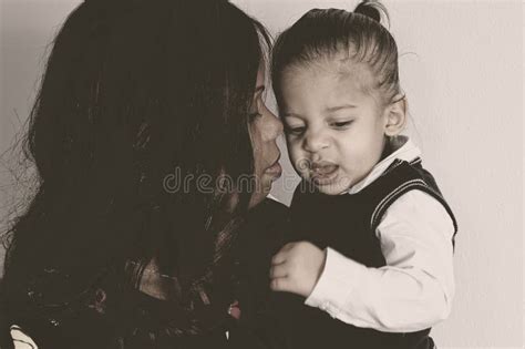 Brazilian Origin Mother With Her Son In Her Arms Stock Image Image