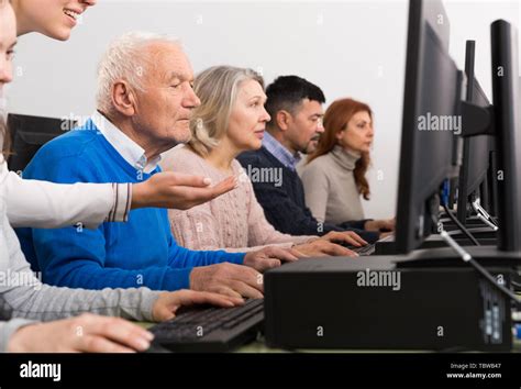 Portrait Of Focused Senior Man During Computer Classes For Elderly