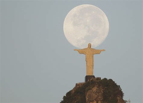 Moon Behind The Christ The Redeemer Statue In Rio De Janeiro Brazil