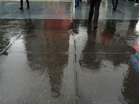 Premium Photo Reflection Of People In Puddle