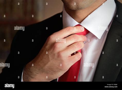 Man Adjusting His Tie Stock Photo Alamy
