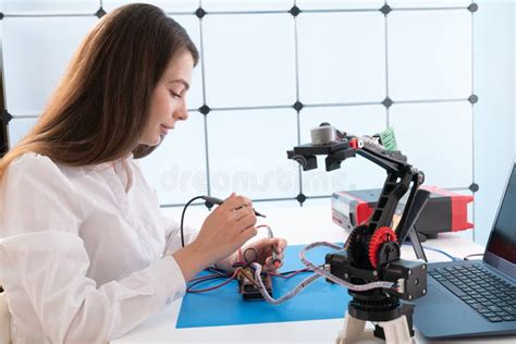 A Young Woman Writes An Algorithm For The Robot Arm Science Research