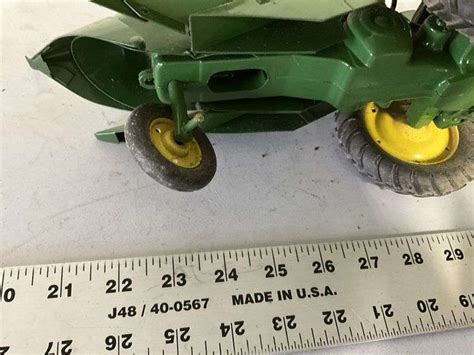 John Deere Picker Tractor Missing One Wheel On Legacy Auction Company