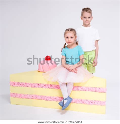 A Boy Sitting On A Big Cake Over 209 Royalty Free Licensable Stock