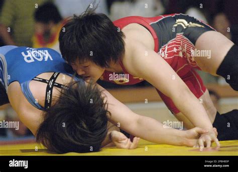 Japans Mami Shinkai Right And South Koreas Han Tae Yang Wrestle