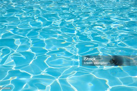 Beautiful Ripple Water Surface With Sun Reflection In Swimming Pool