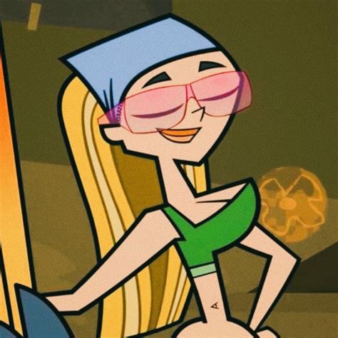 A Cartoon Character With Glasses And A Green Dress