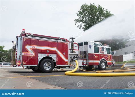 Firetruck Spraying Water At Local Fire Department Wetdown Editorial