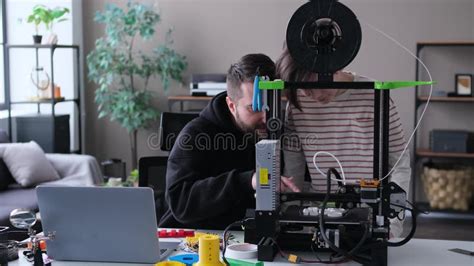 Father And Son Using 3d Printer And Communicating Stock Footage Video Of Mood Table 309696740
