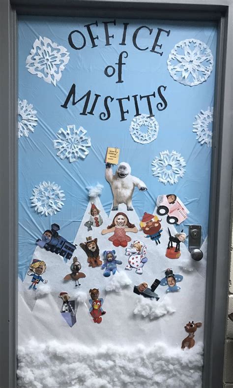 An Office Door Decorated With Snow And Christmas Decorations