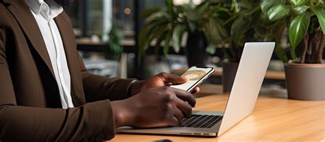 Premium Ai Image African American Man Working With Code On Smartphone At Office Desk It