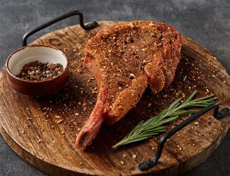 Premium Photo Raw Tomahawk Steak In Rub Marinade For Bbq