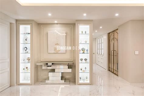 공감인테리어디자인 마블 패턴의 바닥 타일과 어우러지는 과하지 않은 패턴의 빅슬랩으로 Tv월을 마감하고 Tv를 매입할 터널벽을 신설하였습니다 비대칭형 구조에