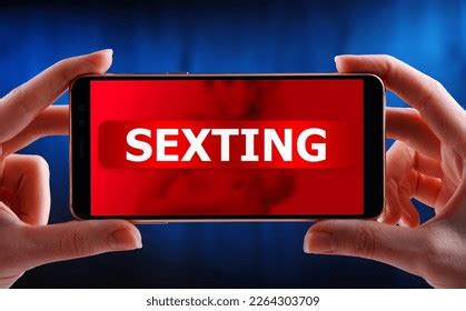 Hands Holding Smartphone Displaying Sign Sexting Stock Photo 2264303709 Shutterstock