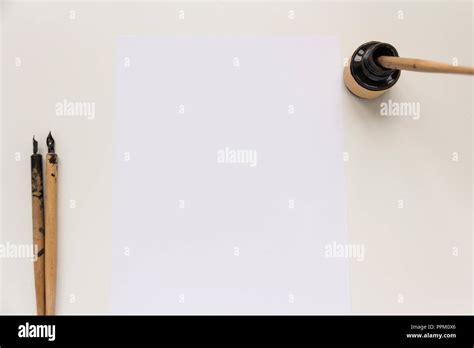 An Old Nib Pen A Bottle Of Black Ink A Sheet Of Paper With Place For Text Invitation Letter