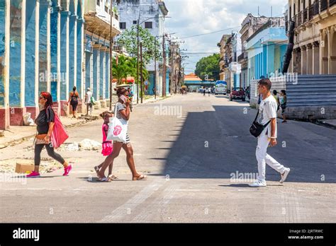 Lifestyle Of Real Cuban People Who Are Walking In A City Street