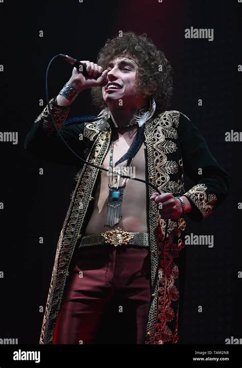 Singer Josh Kiszka Is Shown Performing On Stage During A Live Concert