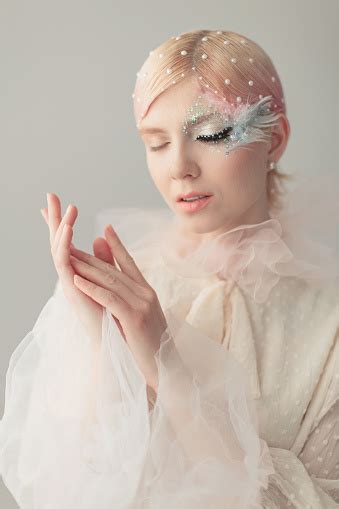 Blonde Girl In White Blouse In Studio On White Background Short Pink