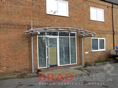 Large Curved Glass And Steel Panel Canopy In An Entrance Installed In London