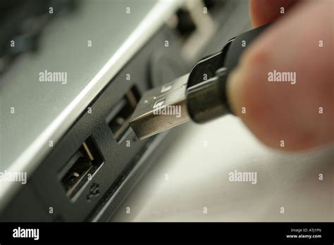 Close Up Of Hand Plugging In A Usb Plug Into Port On Laptop Computer Stock Photo Alamy