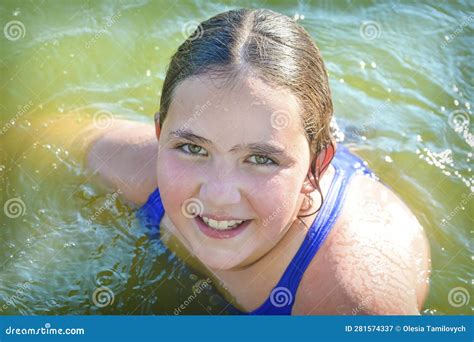 In The Summer On The Beach A Girl Lies In The River Stock Image